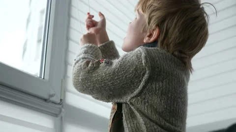 Little Boy Kid Opens Window Roller Shutt... | Stock Video | Pond5
