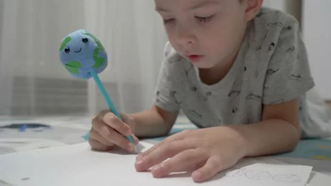 A Little Boy Is Learning To Draw With A Stock Video Pond5