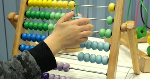 Little boy moves adding numbers using ab... | Stock Video | Pond5
