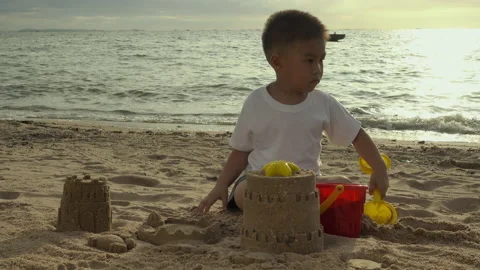 little boy playing sand with toy sand to... | Stock Video | Pond5