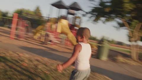 Little Boy Running Around and Chasing Hi... | Stock Video | Pond5