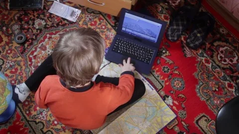 A little boy sitting on the floor in the... | Stock Video | Pond5