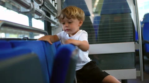 Little boy sitting at train seat child t... | Stock Video | Pond5