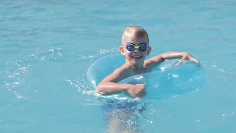 Little boy in swimming pool, child havin... | Stock Video | Pond5