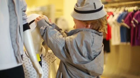 Little boy takes off hat of dummy in Chi... | Stock Video | Pond5
