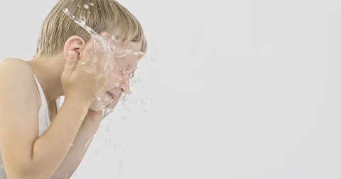 Little boy washing her face with water. ... | Stock Video | Pond5