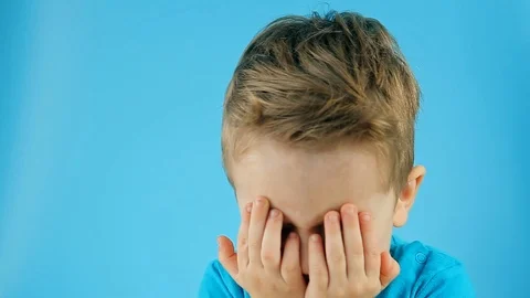 Little boy yelling at blue background. C... | Stock Video | Pond5