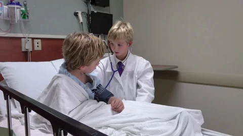 Little boys playing doctor and patient i... | Stock Video | Pond5