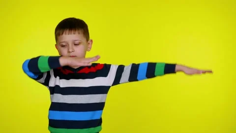 Little child boy makes a dance movement ... | Stock Video | Pond5