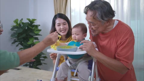 A little child eating his first meal, pa... | Stock Video | Pond5