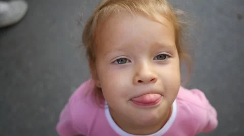 Little child girl face portrait grimace ... | Stock Video | Pond5