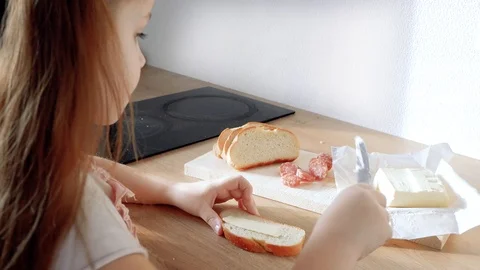 little child making sandwich with butter... | Stock Video | Pond5