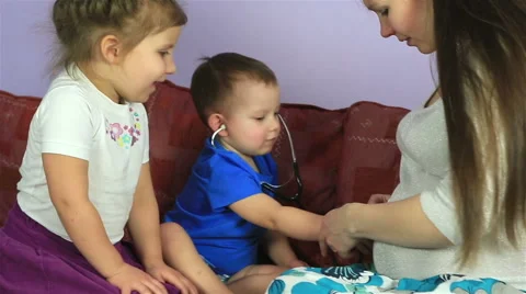 Little children listen to his brother in... | Stock Video | Pond5