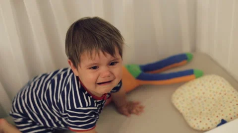 Little cute boy wearing blue striped pij... | Stock Video | Pond5