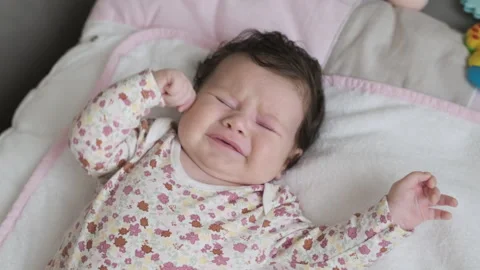 Little daughter cranky of stomach pain w... | Stock Video | Pond5