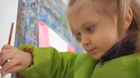 A little girl is in an art Studio, sitti... | Stock Video | Pond5