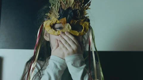 Little girl with an autumn leaf mask clo... | Stock Video | Pond5