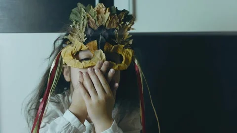 Little girl with an autumn leaf mask clo... | Stock Video | Pond5