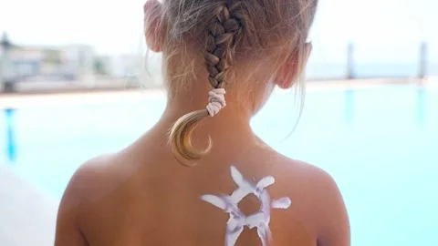 Little girl back with sunscreen on her b... | Stock Video | Pond5