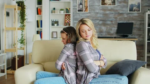 Little girl with bad behavior sitting ba... | Stock Video | Pond5