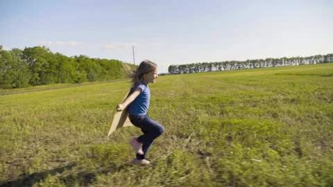 Child Running In Field Stock Footage ~ Royalty Free Stock Videos | Pond5