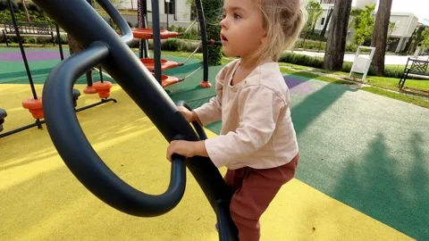 Little girl climbing the arched monkey b... | Stock Video | Pond5