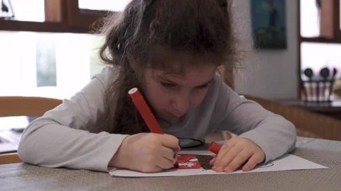 Little girl consternated on drawing. Us... | Stock Video | Pond5