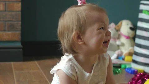 A little girl is crying no the floor | Stock Video | Pond5