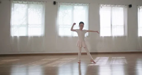 Little girl dancing alone in a studio | Stock Video | Pond5