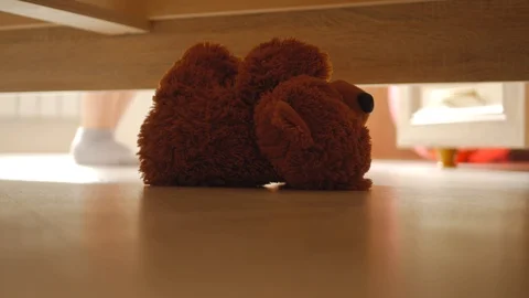 A little girl finding her beloved teddy ... | Stock Video | Pond5