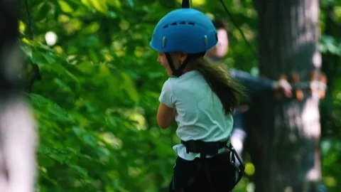 A little girl hanging on the insurance c... | Stock Video | Pond5