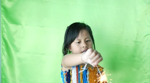 Little girl having fun with sparkles on ... | Stock Video | Pond5