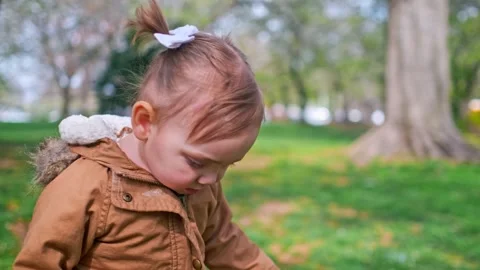 Little girl having a questionable look a... | Stock Video | Pond5