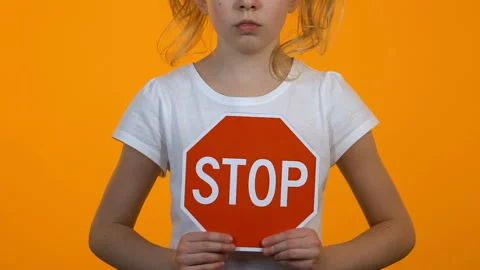 Little girl holding stop sign template i... | Stock Video | Pond5