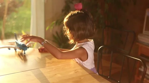 Little girl imagination, playing with ai... | Stock Video | Pond5