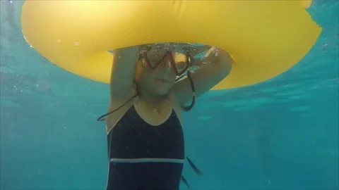 Little girl with inflatable rubber circl... | Stock Video | Pond5