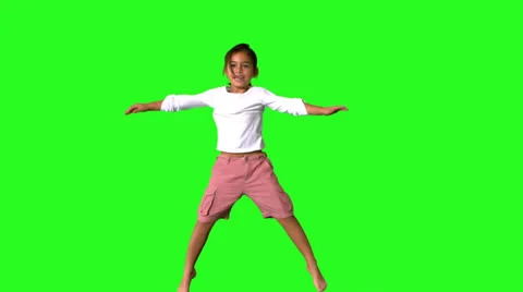 Little girl jumping on green screen | Stock Video | Pond5