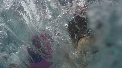 Little Girl Jumps From springboard in to... | Stock Video | Pond5