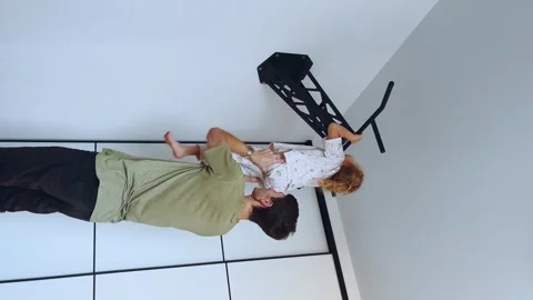 A little girl is learning to pull up on ... | Stock Video | Pond5