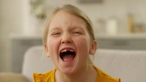 Little girl looking at camera screaming ... | Stock Video | Pond5