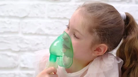 Little girl makes inhalation with medica... | Stock Video | Pond5