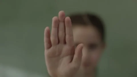 Little girl makes a stop sign with her h... | Stock Video | Pond5