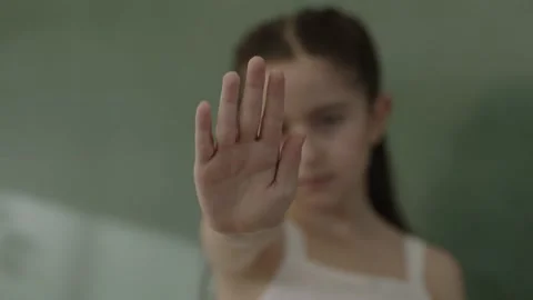 Little girl makes a stop sign with her h... | Stock Video | Pond5