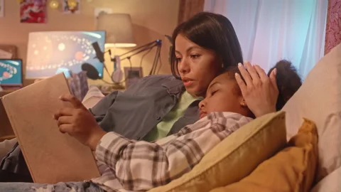 Little Girl Napping while Her Mother Rea... | Stock Video | Pond5
