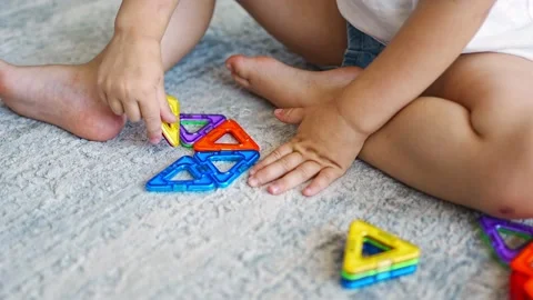 Little girl playing colorful magnet plas... | Stock Video | Pond5