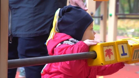little girl playing with cubes on the Pl... | Stock Video | Pond5