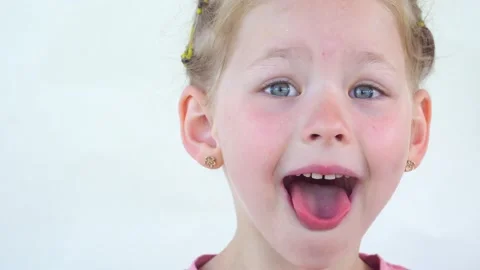 Little girl plays with tongue and saliva... | Stock Video | Pond5