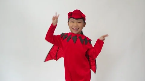 Little girl in red devil costume dancing... | Stock Video | Pond5