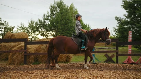little girl is riding pony in equestrian... | Stock Video | Pond5