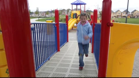 little girl running on playground | Stock Video | Pond5